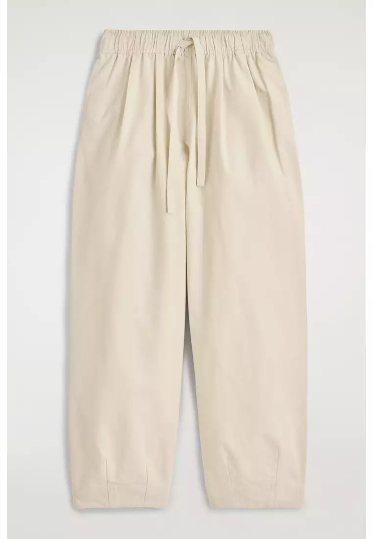 Buy COS COTTON TAPERED DRAWSTRING TROUSERS 2026 Online | ZALORA