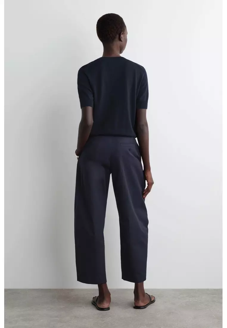 Buy COS PLEATED BARREL-LEG CHINOS 2025 Online | ZALORA