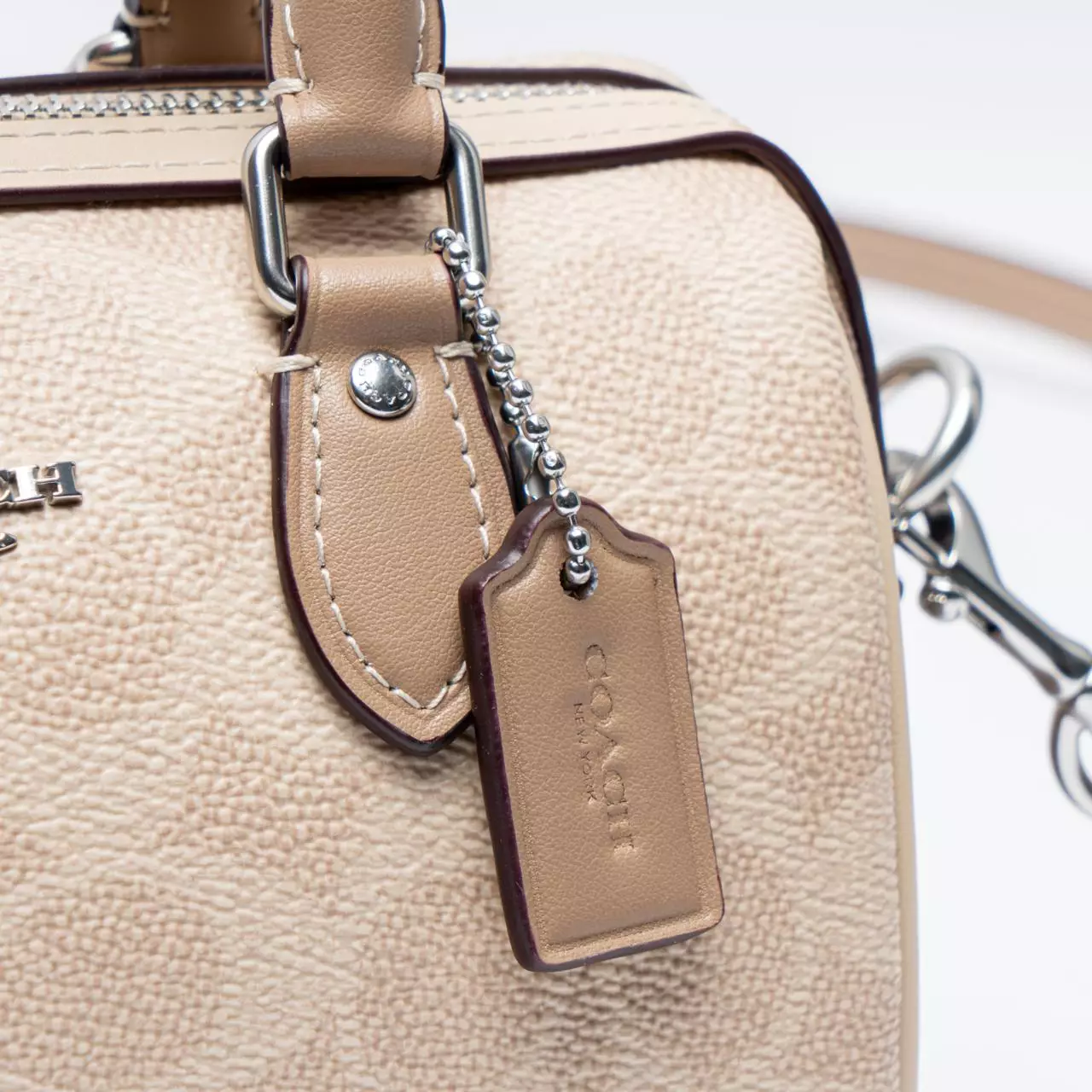 Jual Coach Mini Rowan Crossbody Bag in Blocked Signature Canvas Sand/Taupe Original 2025 ...