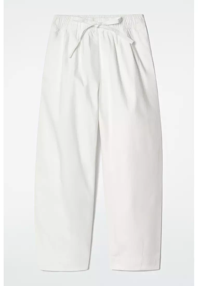 Buy COS COTTON TAPERED DRAWSTRING TROUSERS 2025 Online | ZALORA