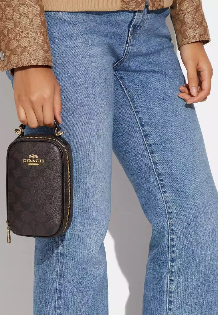 Jual Coach Coach Eva Phone Crossbody In Signature Canvas Brown Black ...