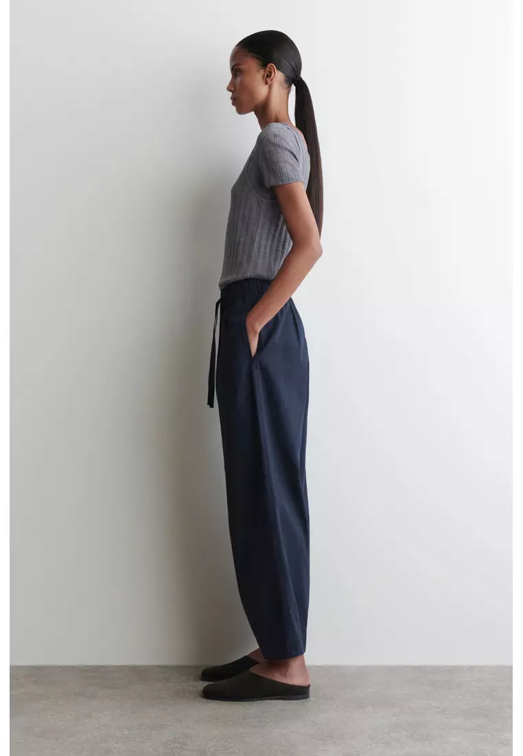 Buy COS COTTON TAPERED DRAWSTRING TROUSERS 2026 Online | ZALORA